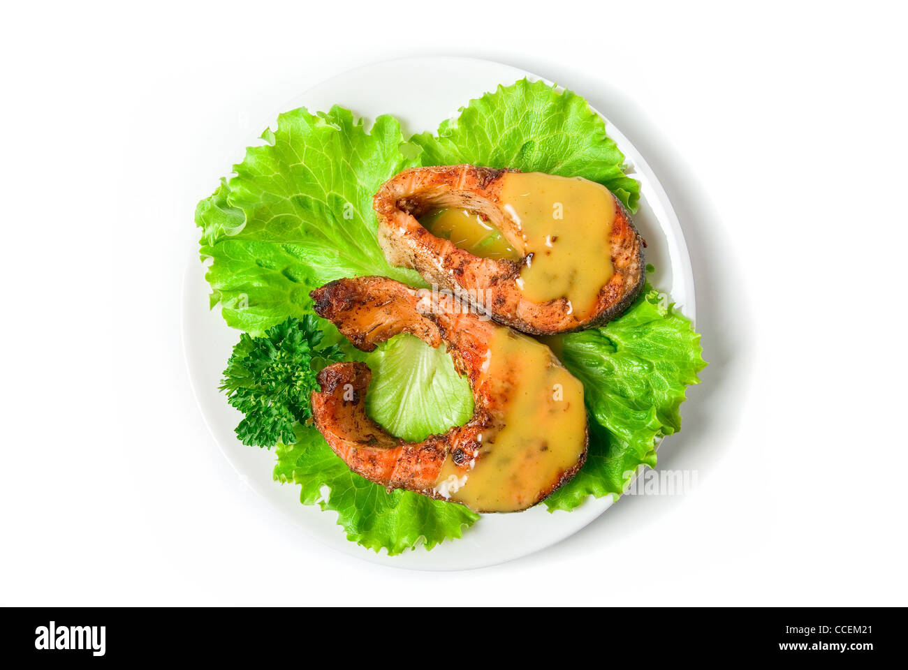 Tasty red fish dish isolated on a white background Stock Photo - Alamy
