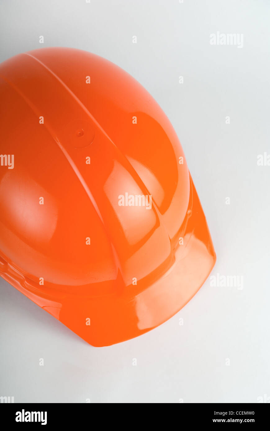 Orange helmet closeup on a white background Stock Photo - Alamy