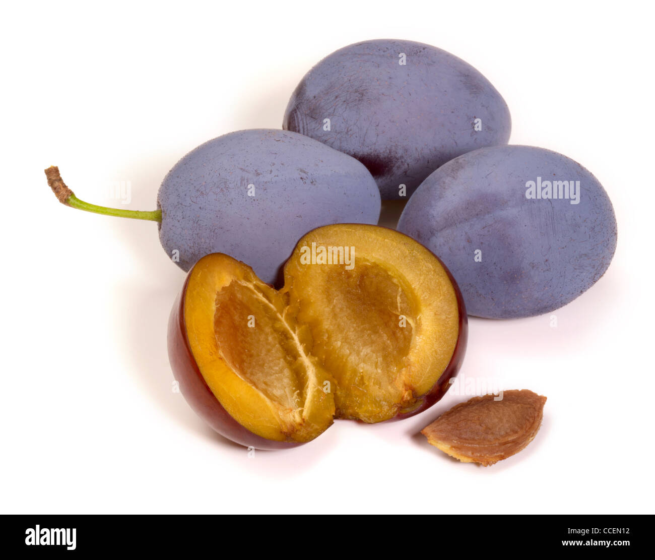 some plums in white back Stock Photo - Alamy