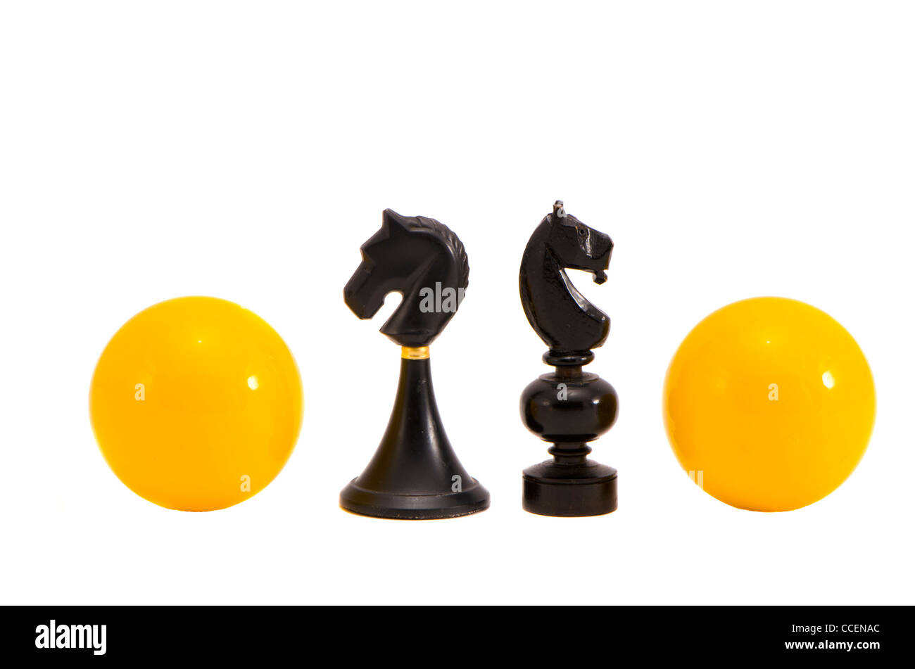 isolated on white two black knight and yellow balls Stock Photo - Alamy