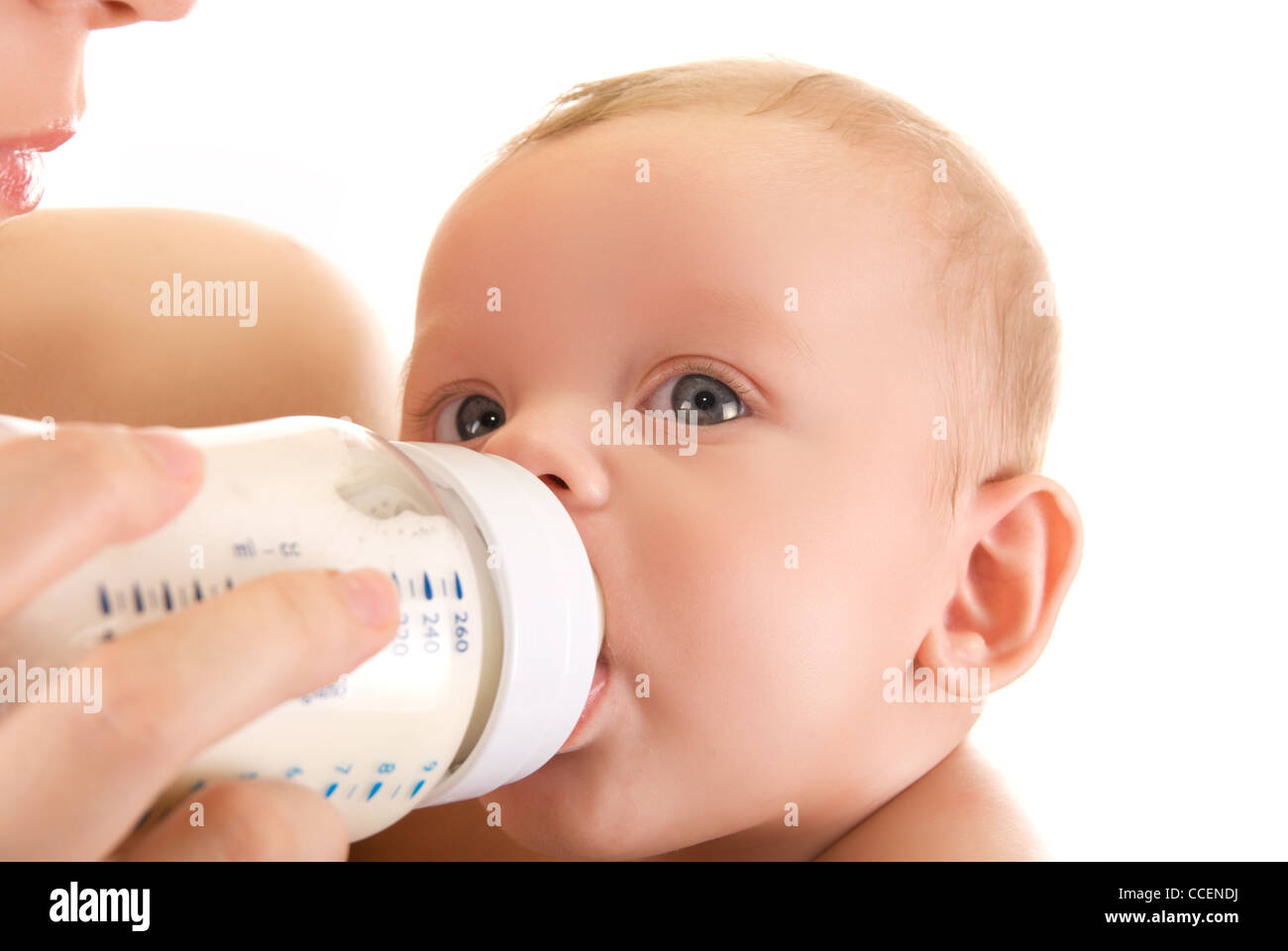 Mother give drink her baby boy by feeding bottle Stock Photo - Alamy