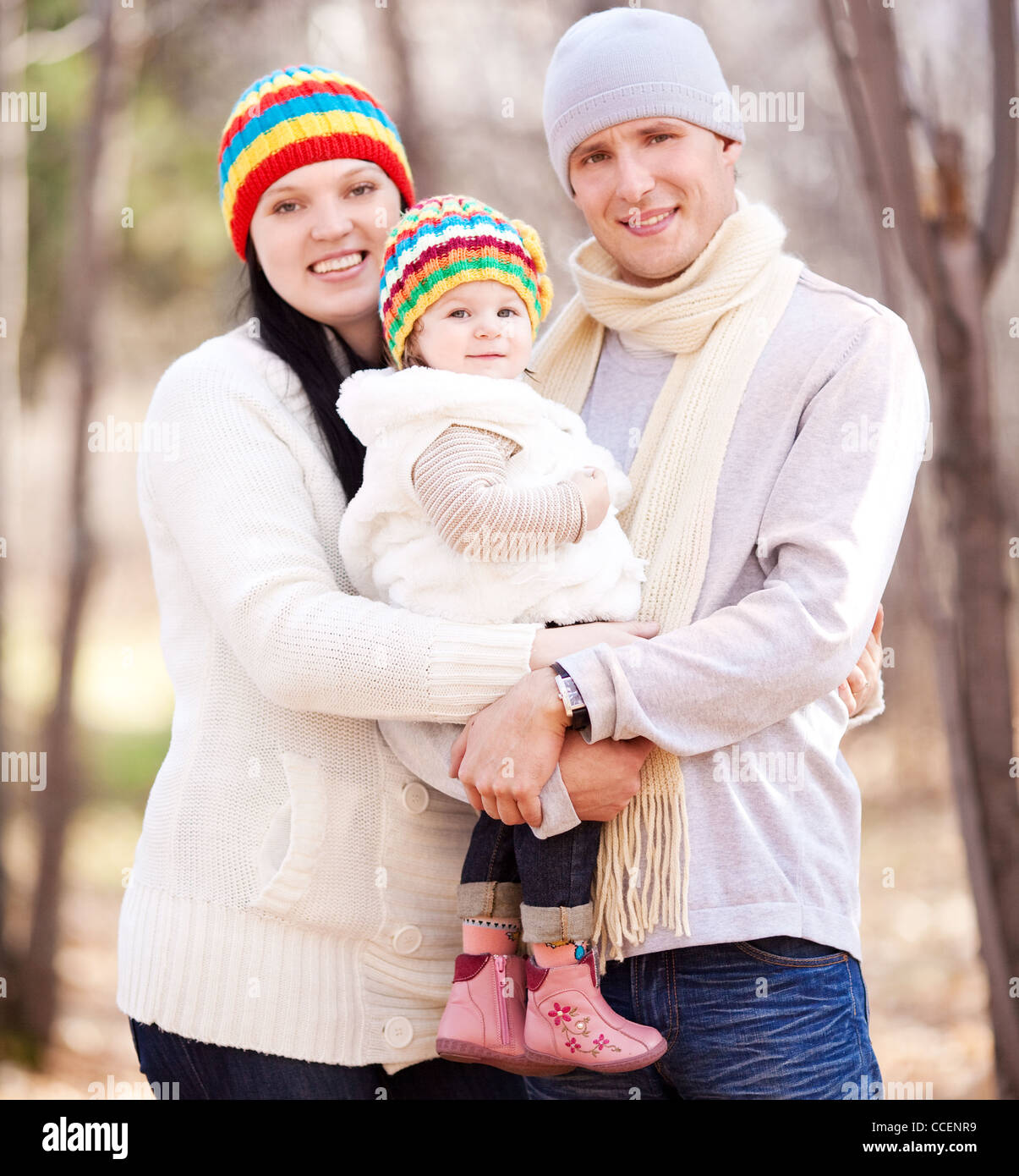 happy young family with their daughter spending time outdoor in the ...