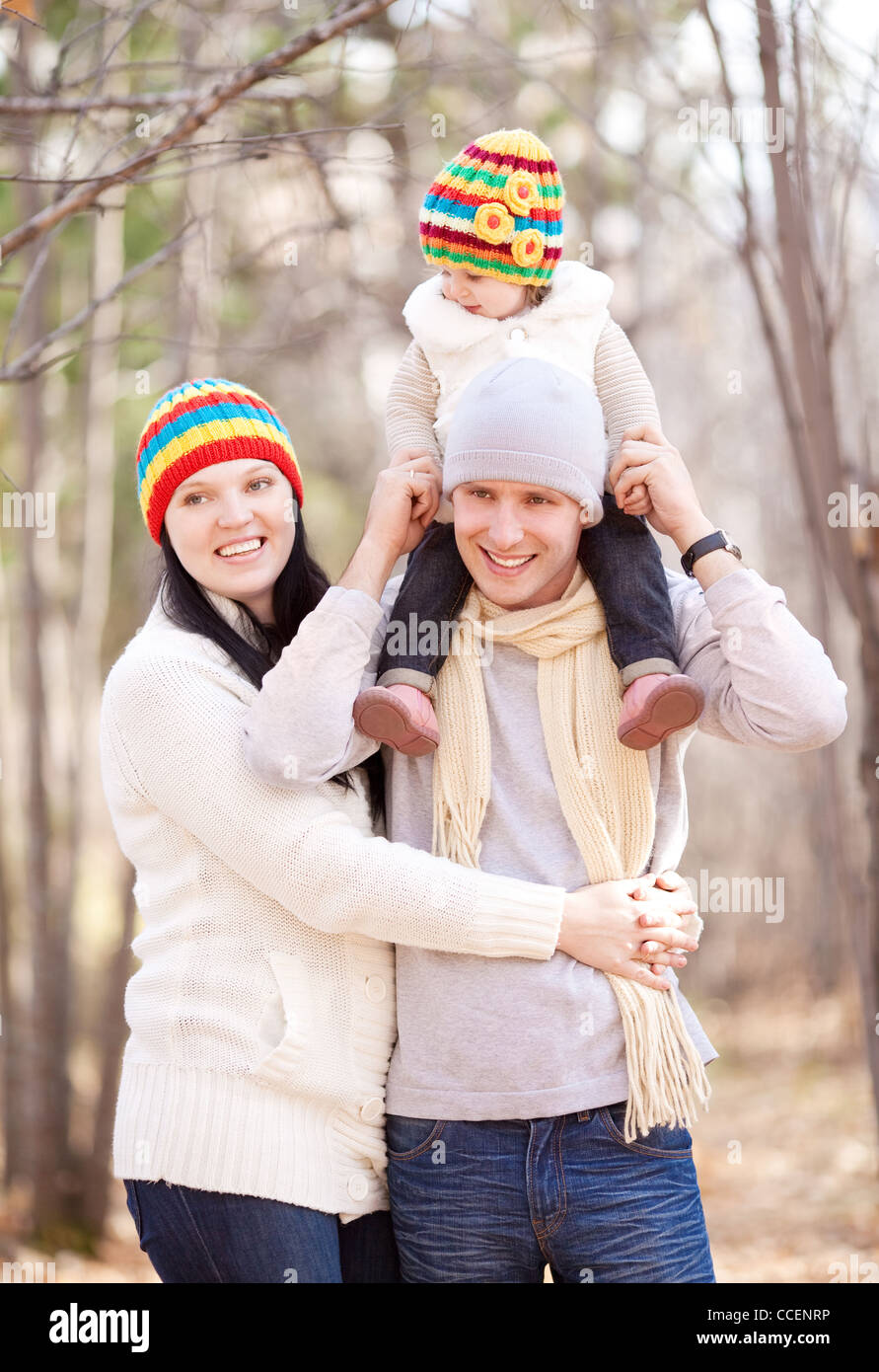 happy young family with their daughter spending time outdoor in the ...