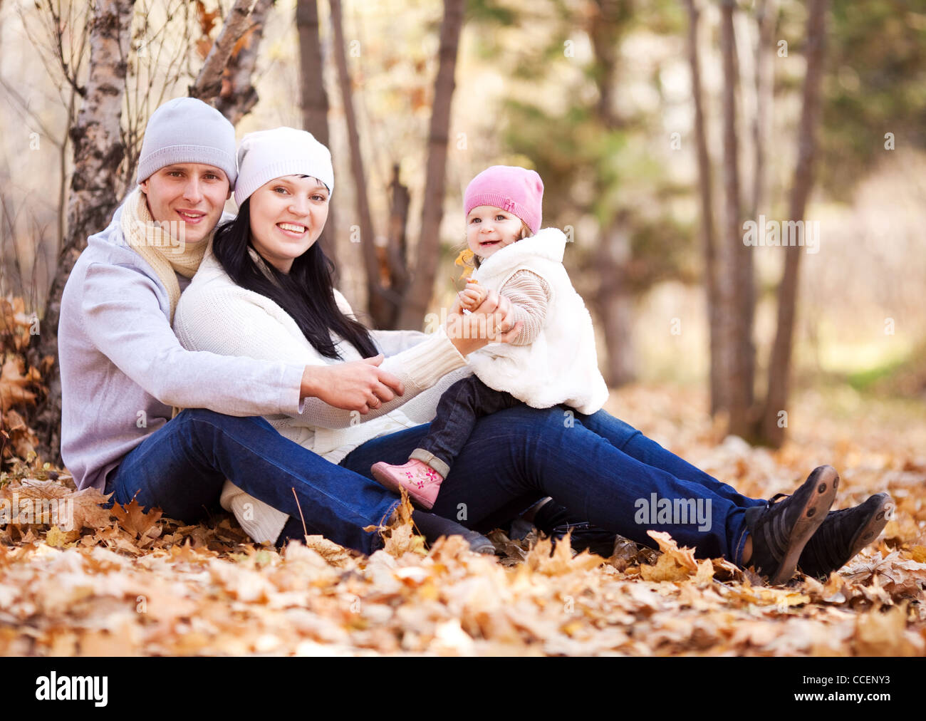 happy young family with their daughter spending time outdoor in the ...