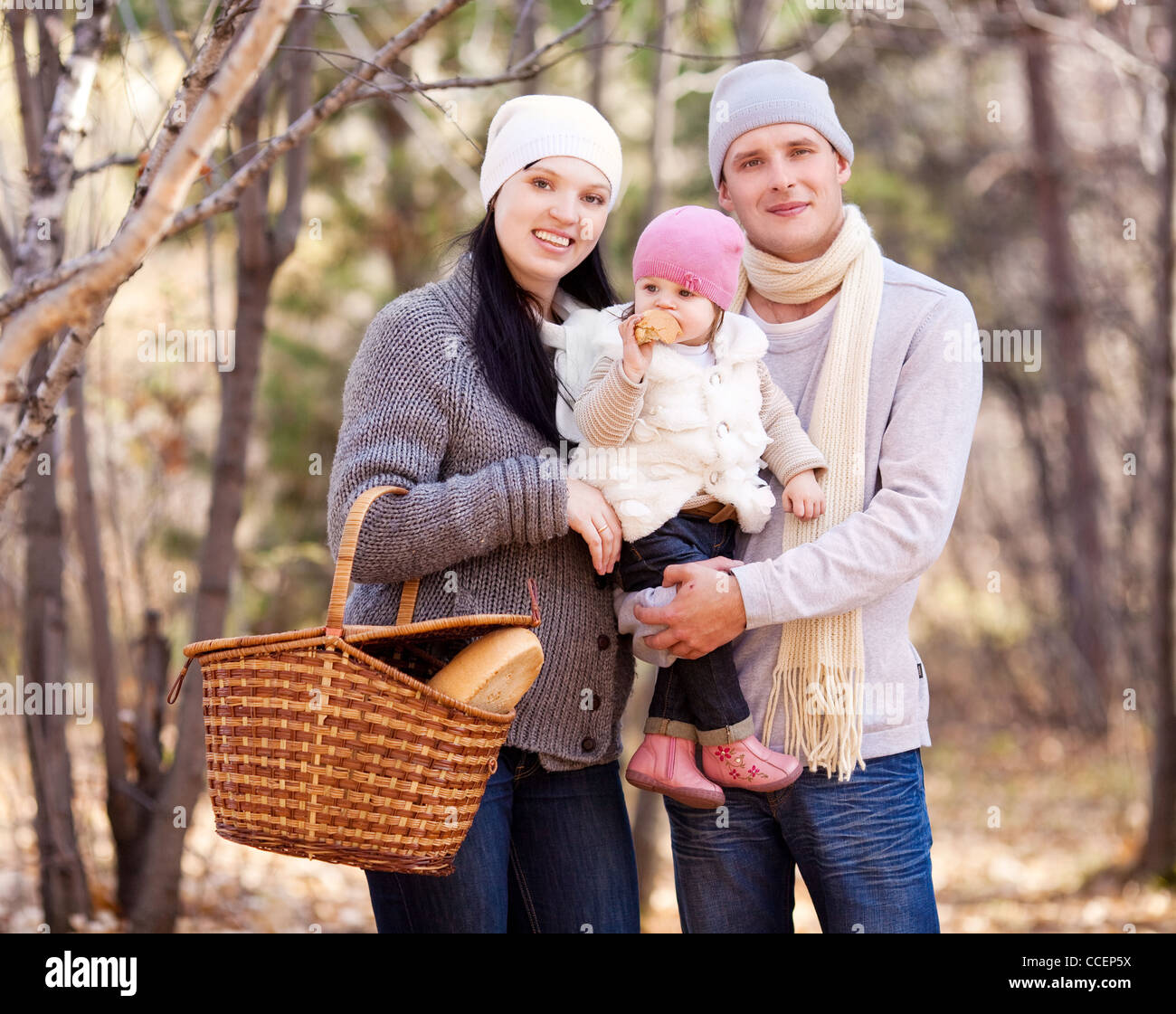happy young family with their daughter spending time outdoor in the ...