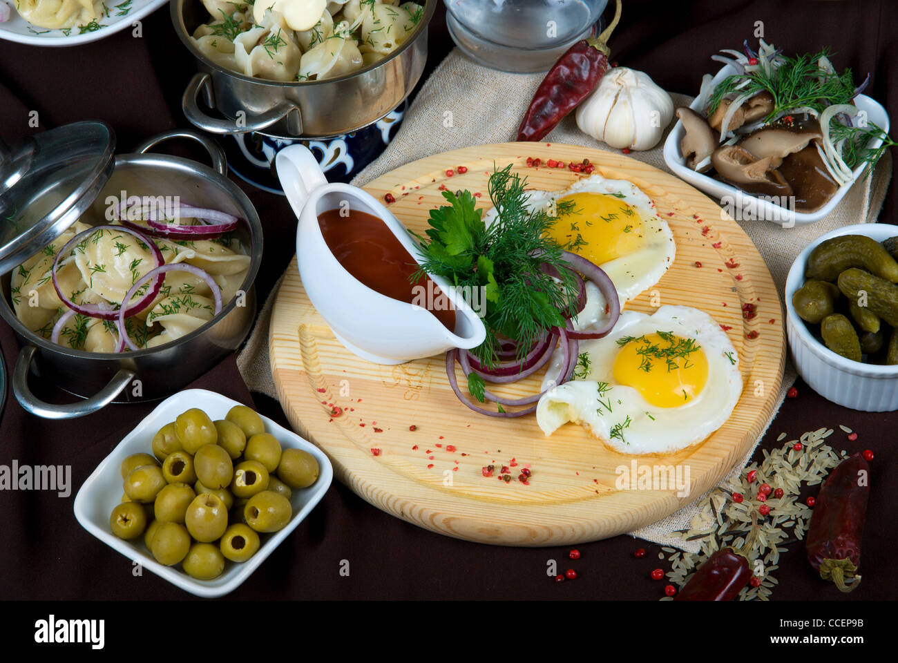 Many food dishes on the restaurant table. close up Stock Photo - Alamy