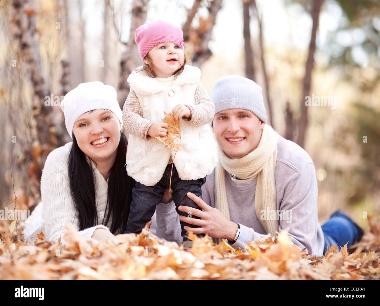 happy young family with their daughter spending time outdoor in the ...