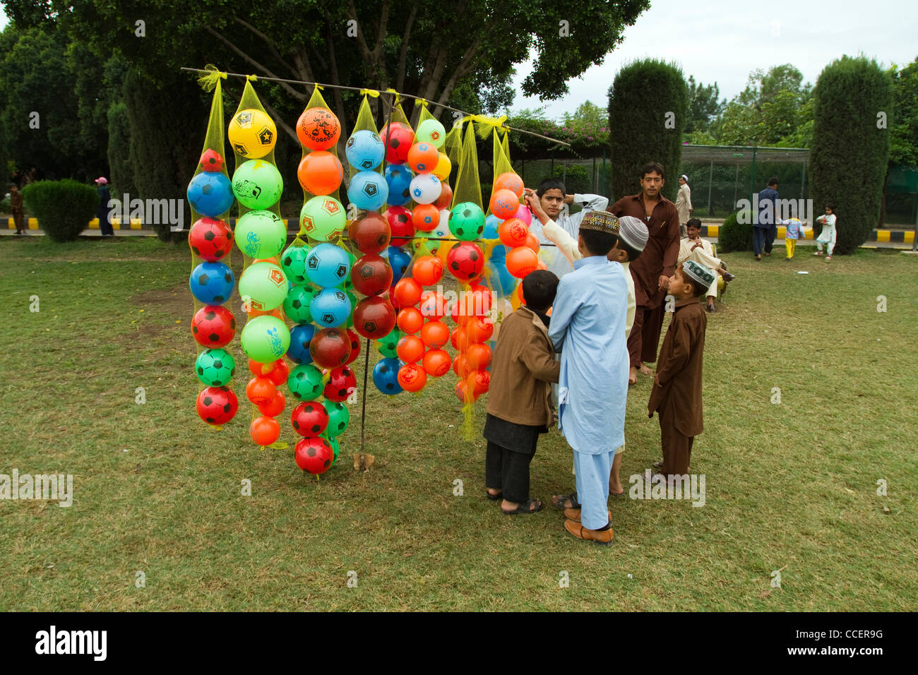 Children buying colorful ball in Peshawar Pakistan Stock Photo - Alamy