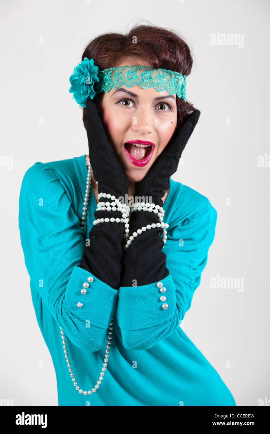Merry woman in a blue dress and black gloves Stock Photo - Alamy