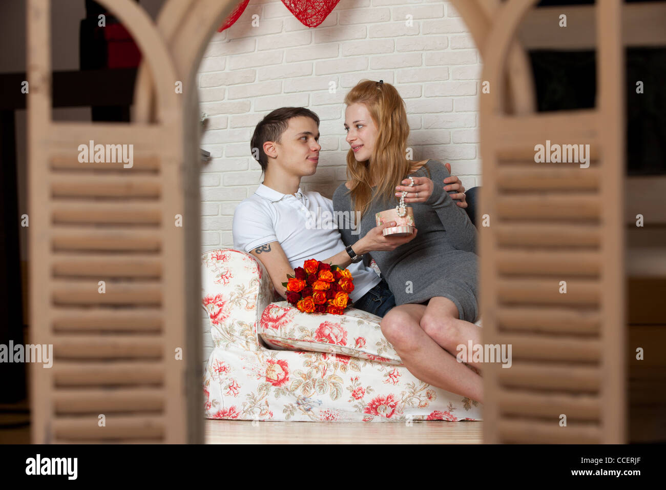 Reflection in a mirror couple the young enamoured Stock Photo - Alamy
