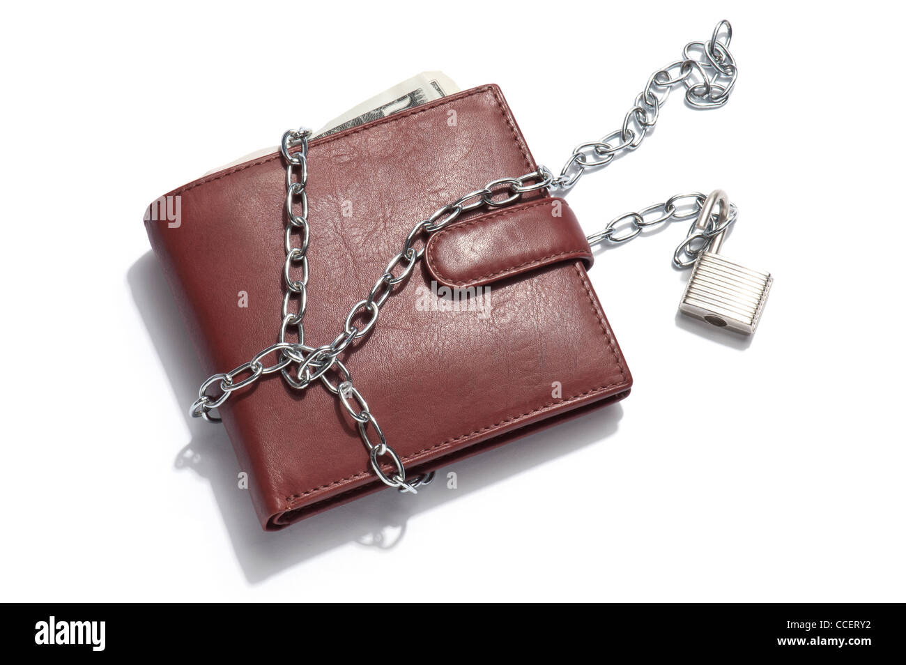 A brown leather wallet containing dollar notes with chain and padlock ...