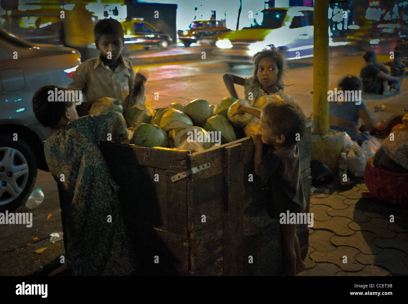 the untouchable of Bombay, Colaba neighborhood children eating nuts ...