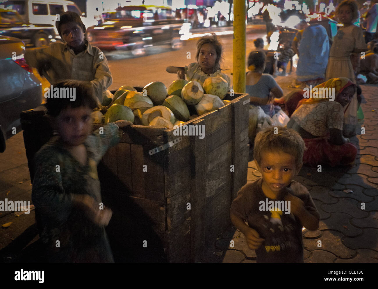 the untouchable of Bombay, Colaba neighborhood children eating nuts ...