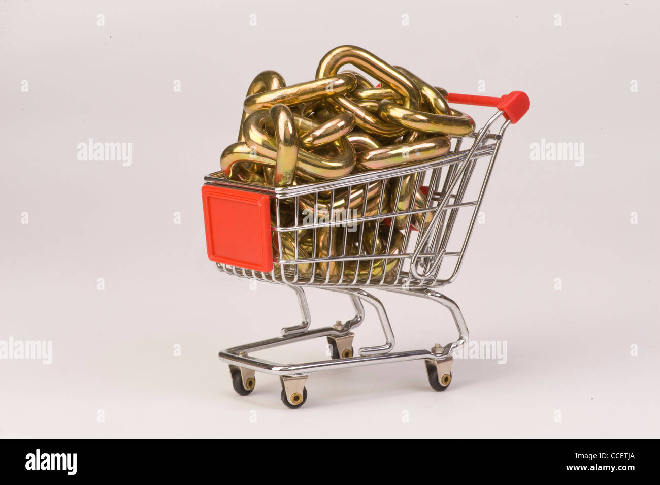 Shopping Cart Full of Golden Chains Stock Photo - Alamy