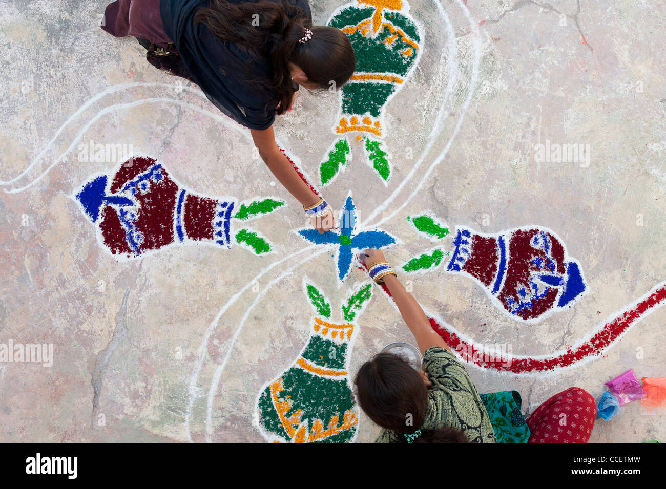 Indian girls design rangoli traditional hi-res stock photography and ...