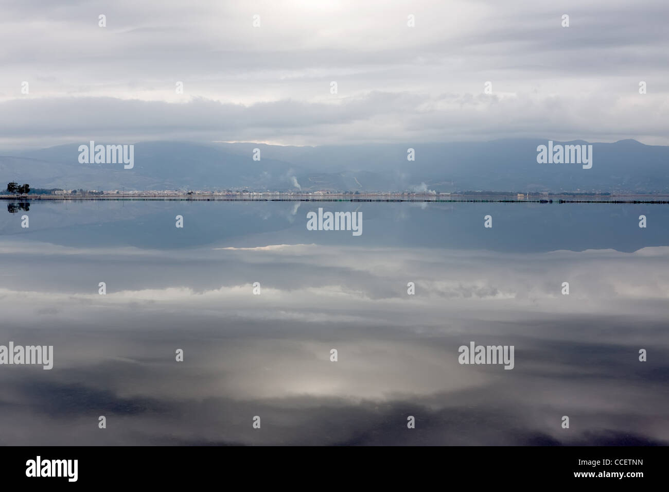 The totally calm water of the lagoon of Mesologgi (Greece), mirroring ...