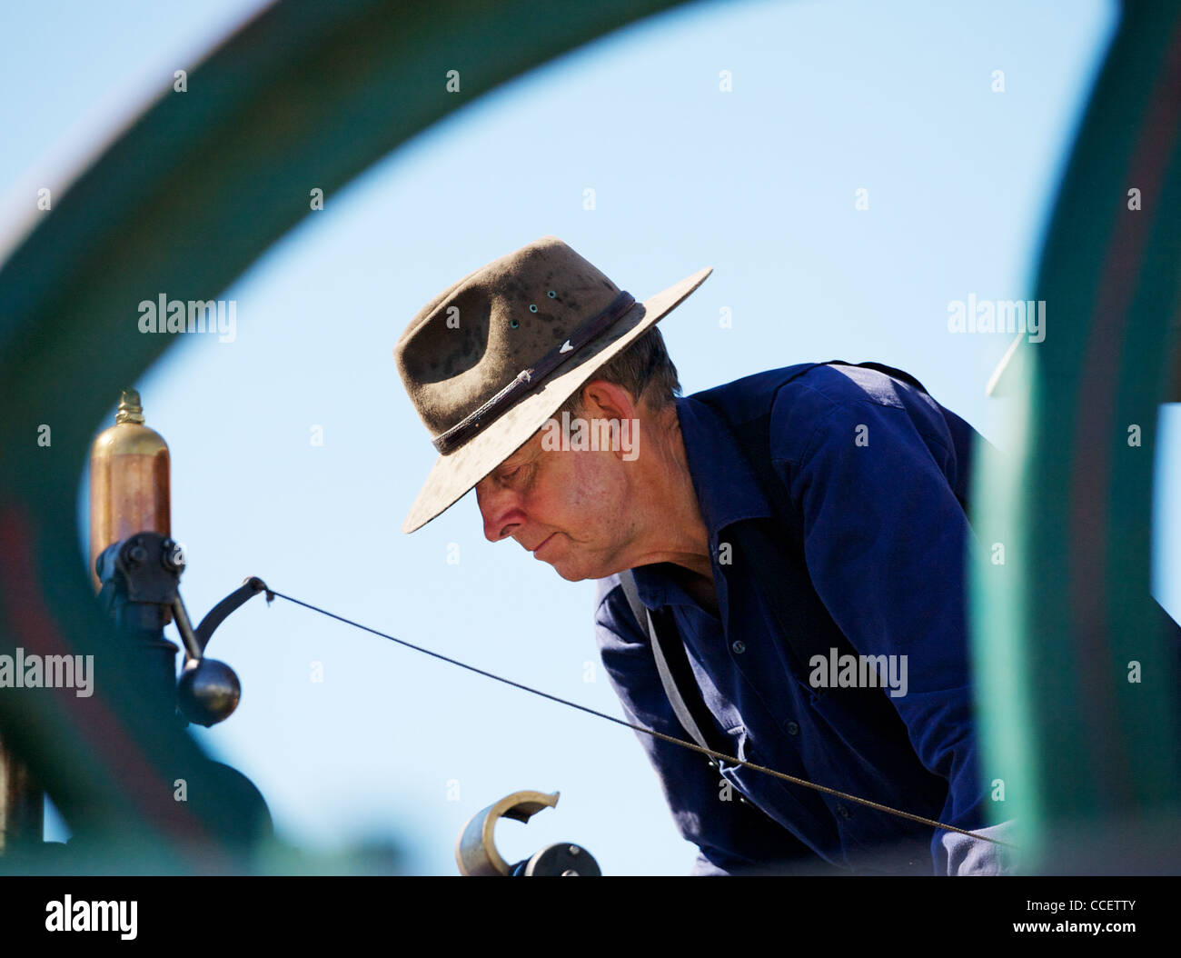 Older man working on steam engine Stock Photo - Alamy