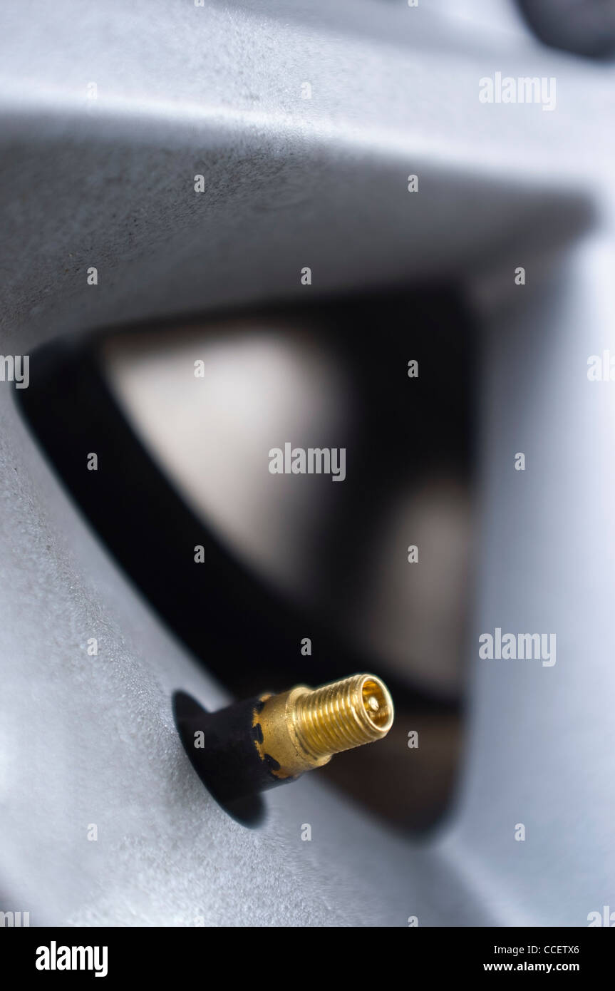 Auto wheel rim with tire valve Stock Photo - Alamy