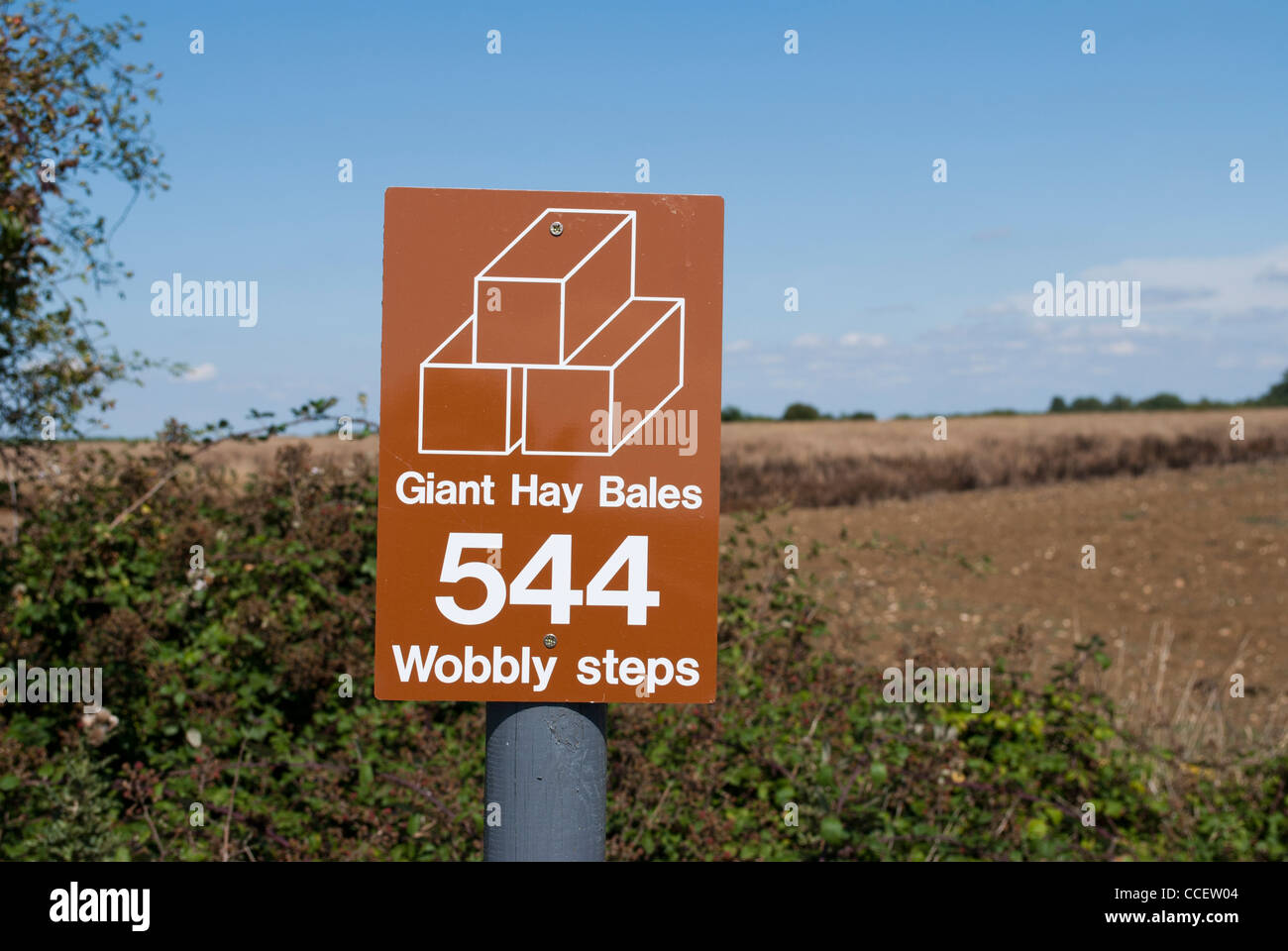 "Giant Hay Bales 544 Wobbly Steps" sign with fields, hedgerow and trees ...