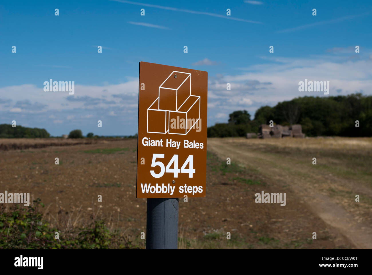 "Giant Hay Bales 544 Wobbly Steps" sign with fields, hedgerow and trees ...
