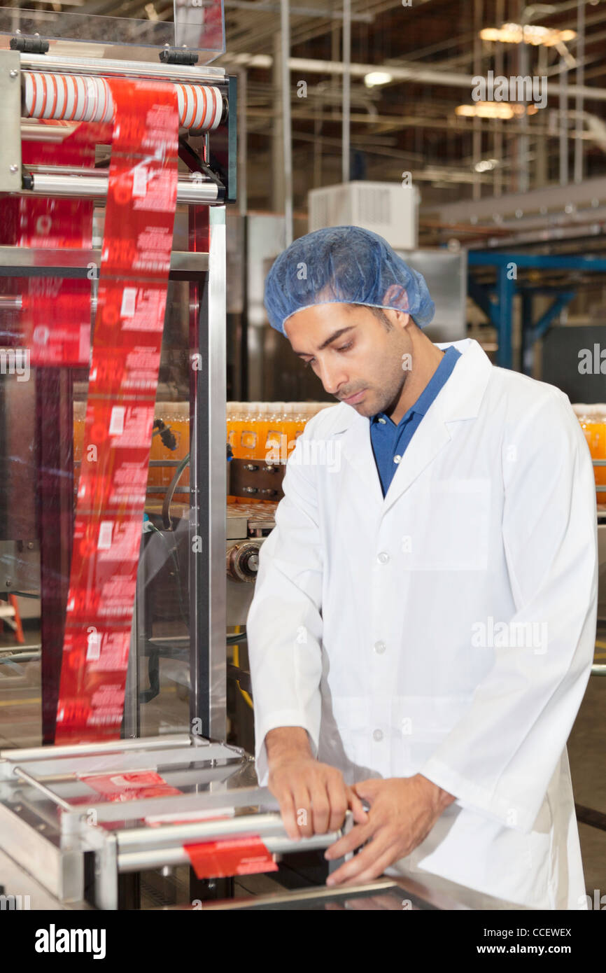Man working at factory Stock Photo - Alamy