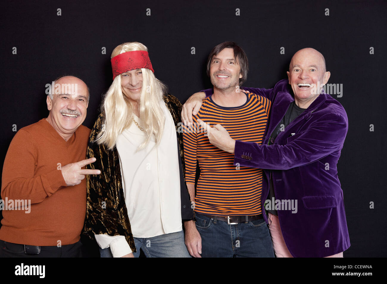 Group of happy male friends against black background Stock Photo - Alamy