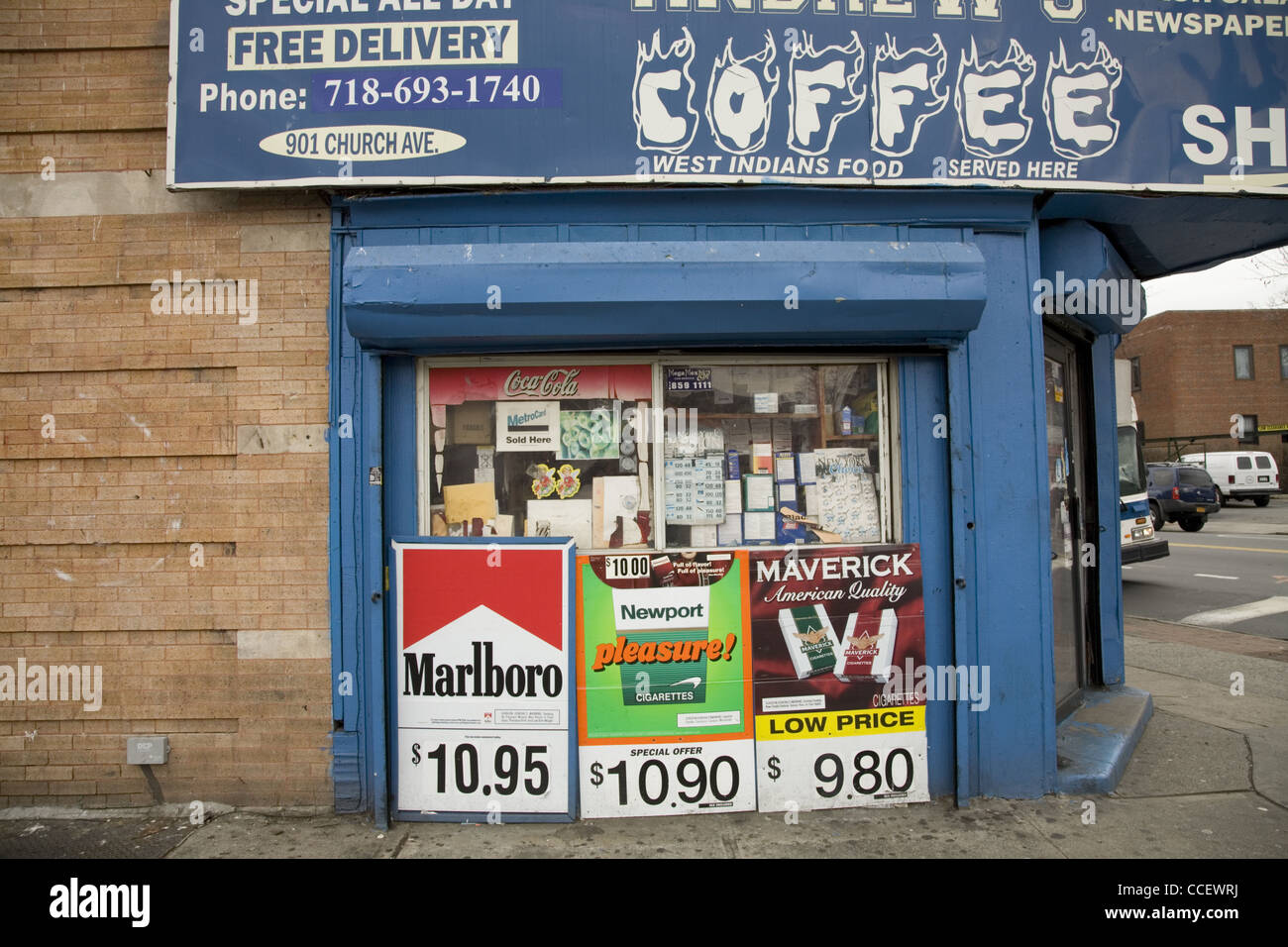 Cigarette ads plastered on a small grocery store in Flatbush, Brooklyn ...