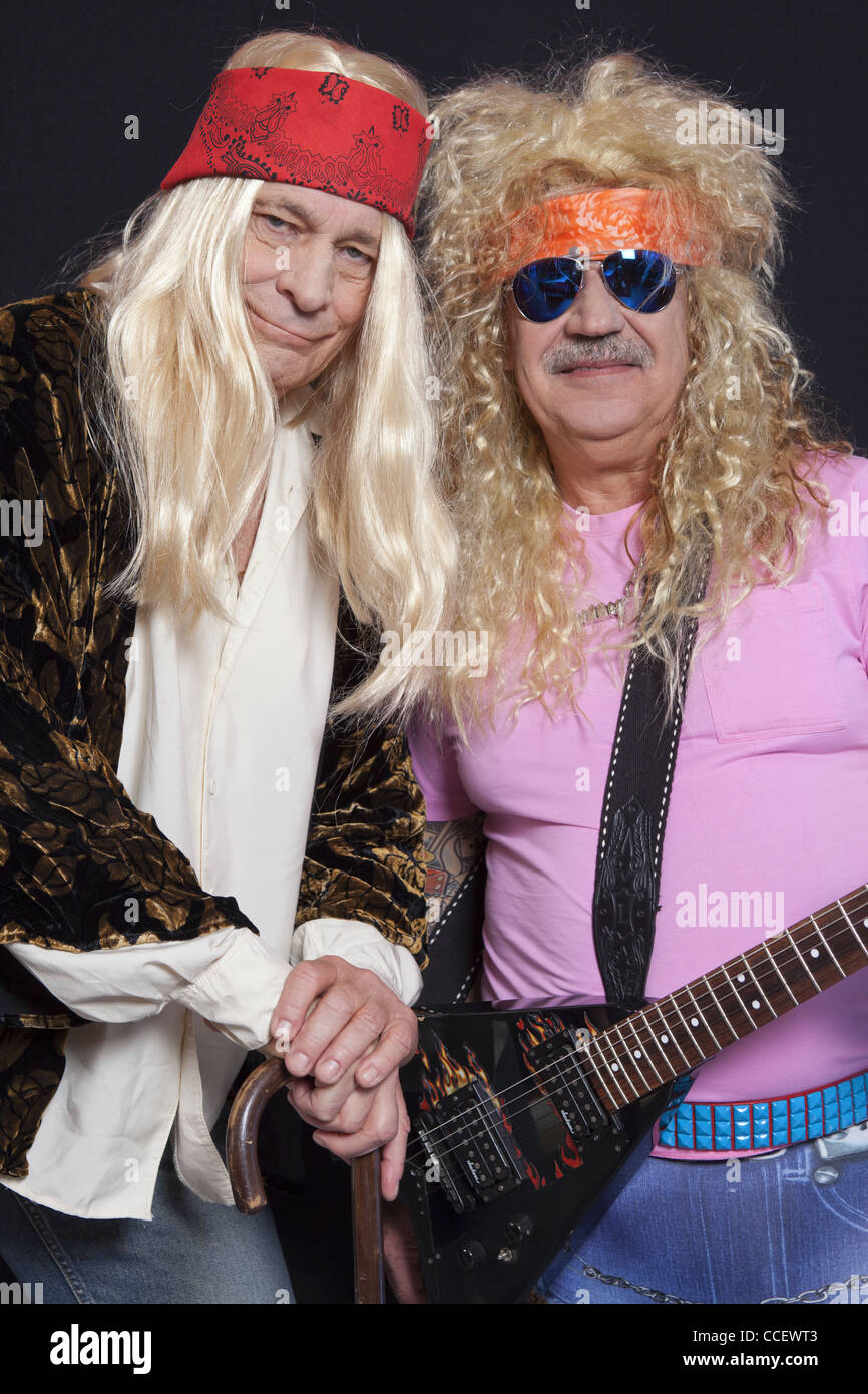 Portrait of smiling musicians over black background Stock Photo - Alamy