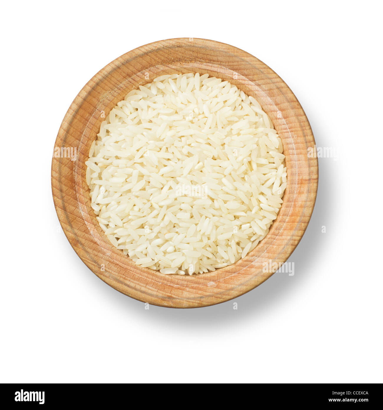 Rice in wood plate with shadow isolated on white background Stock Photo ...