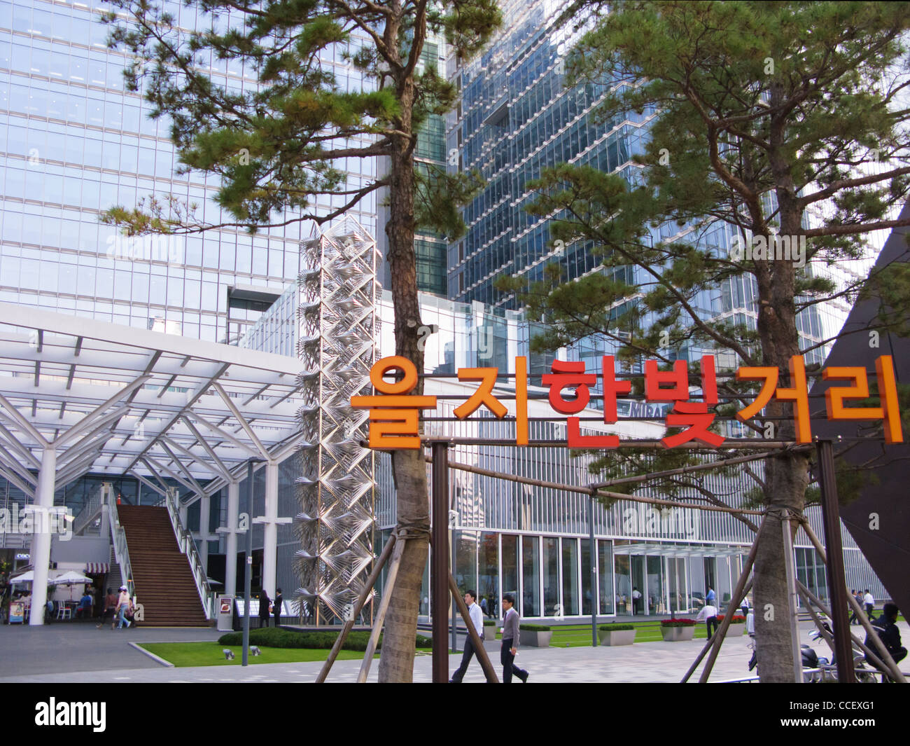 Modern Glass buildings and a huge street name sign in Seoul, Korea ...