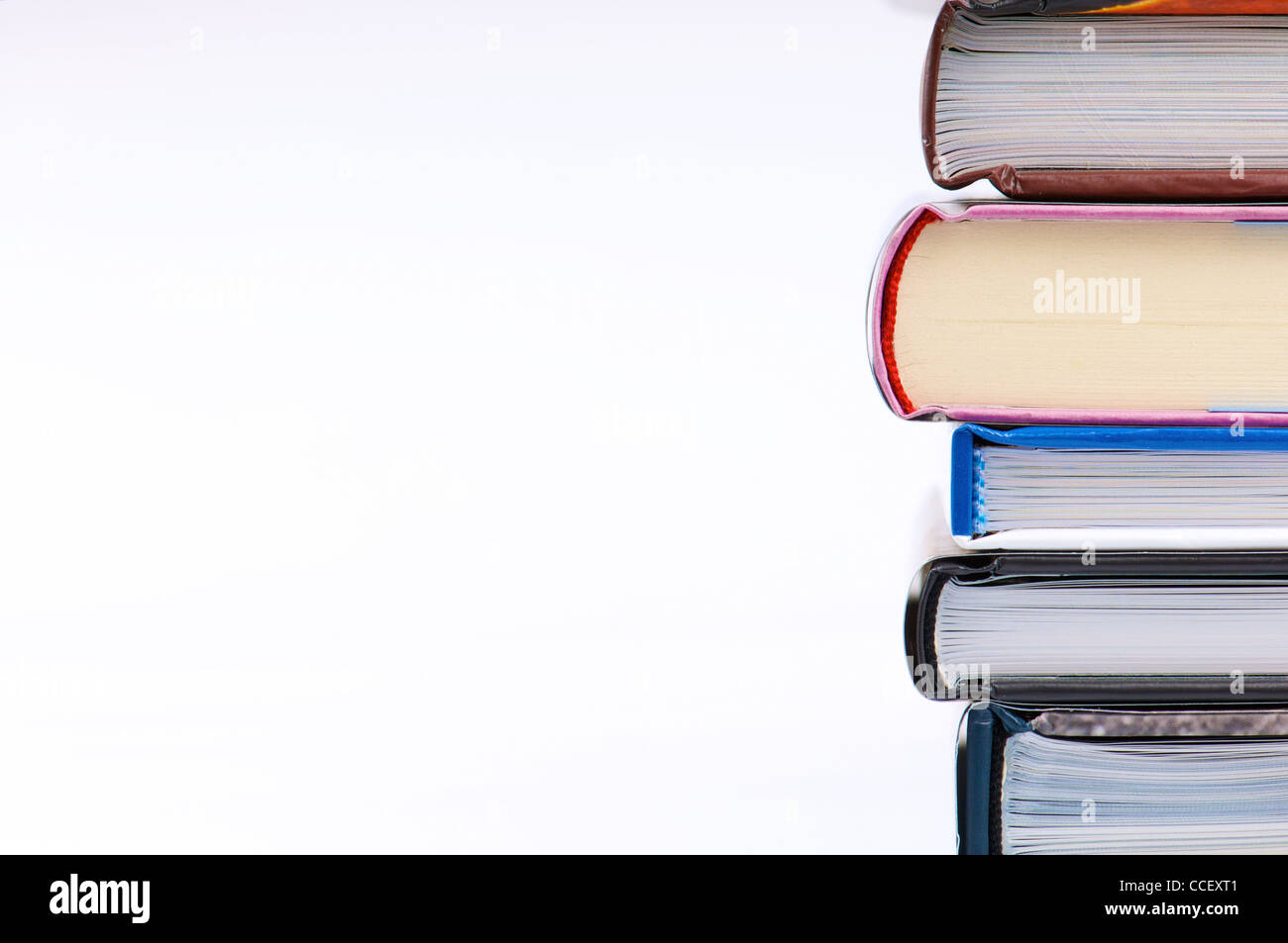 forefront of a group of books stacked Stock Photo - Alamy