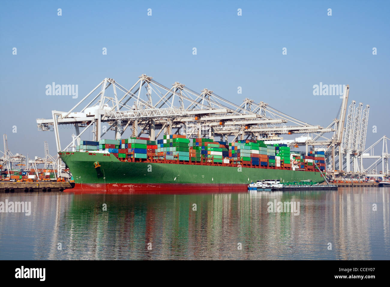 Container ship being loaded in the port of Rotterdam, The Netherlands ...