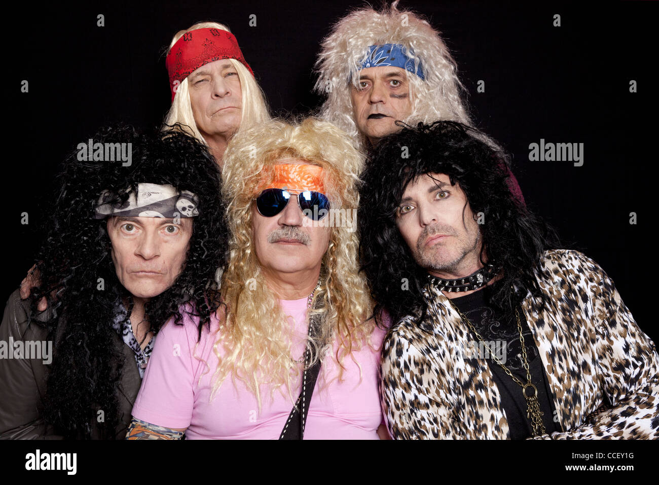 Portrait of rock musicians over black background Stock Photo - Alamy
