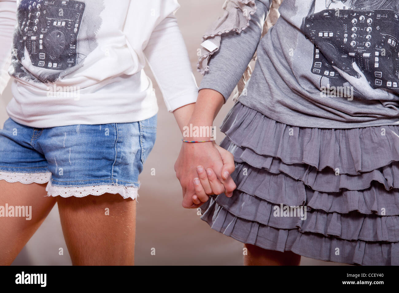 Teenagers holding hands Stock Photo - Alamy