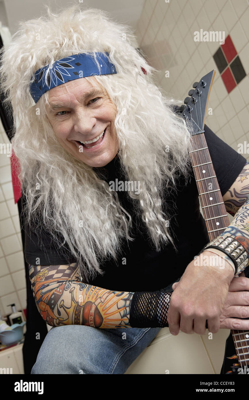Portrait of hippie guitarist laughing Stock Photo - Alamy