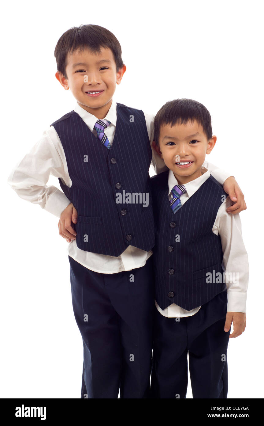 Two happy Asian brothers isolated over white background Stock Photo - Alamy