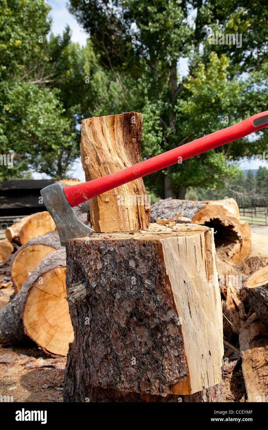 Axe in log stump Stock Photo - Alamy