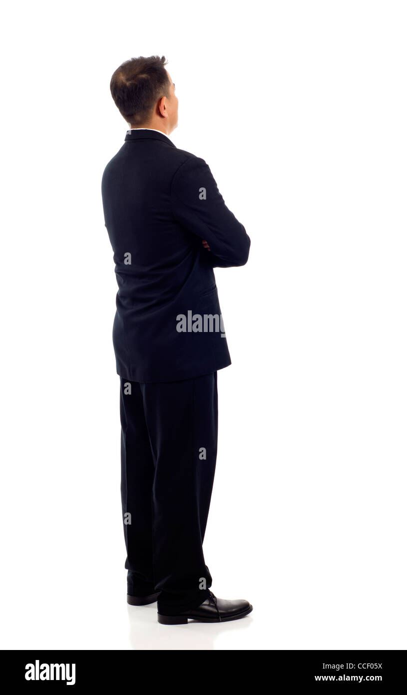 Middle aged Asian business man from the back - looking at something ...