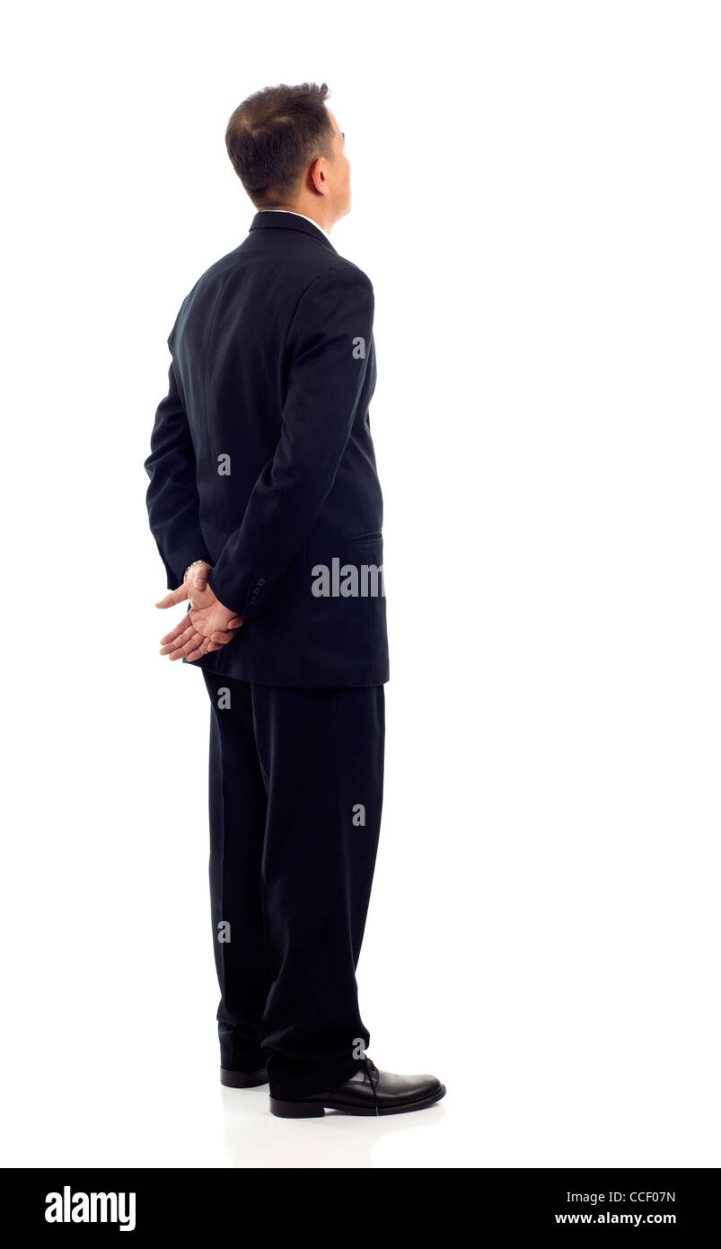 Middle aged Asian business man from the back - looking at something ...