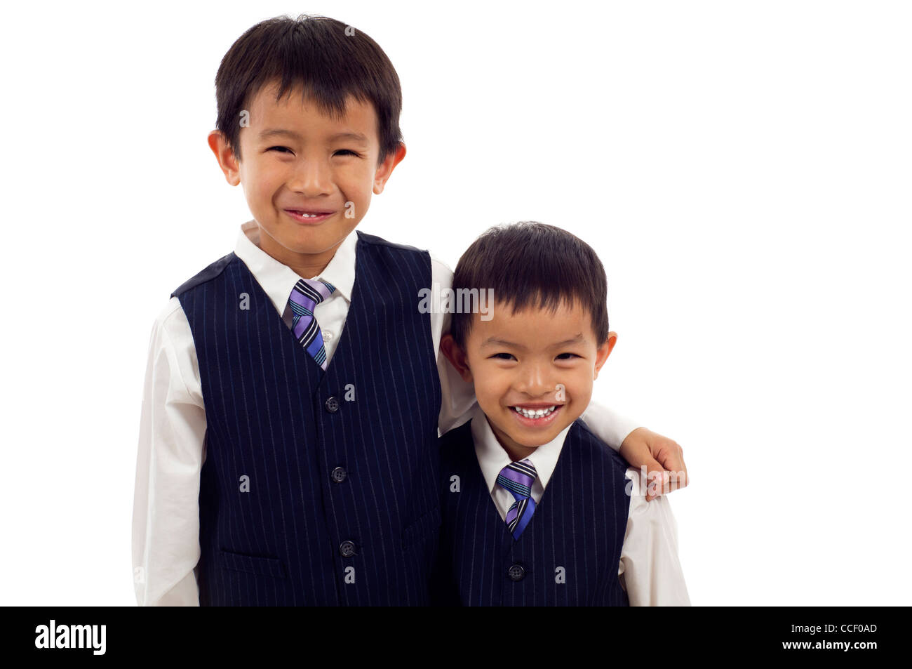 Two happy Asian children isolated over white background Stock Photo - Alamy
