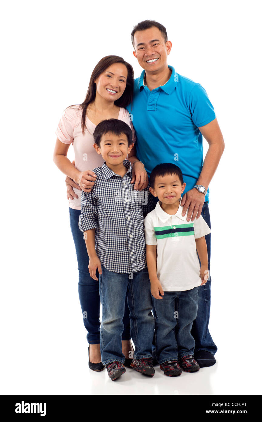 Full length of a happy Asian family of four standing isolated over white background Stock Photo ...