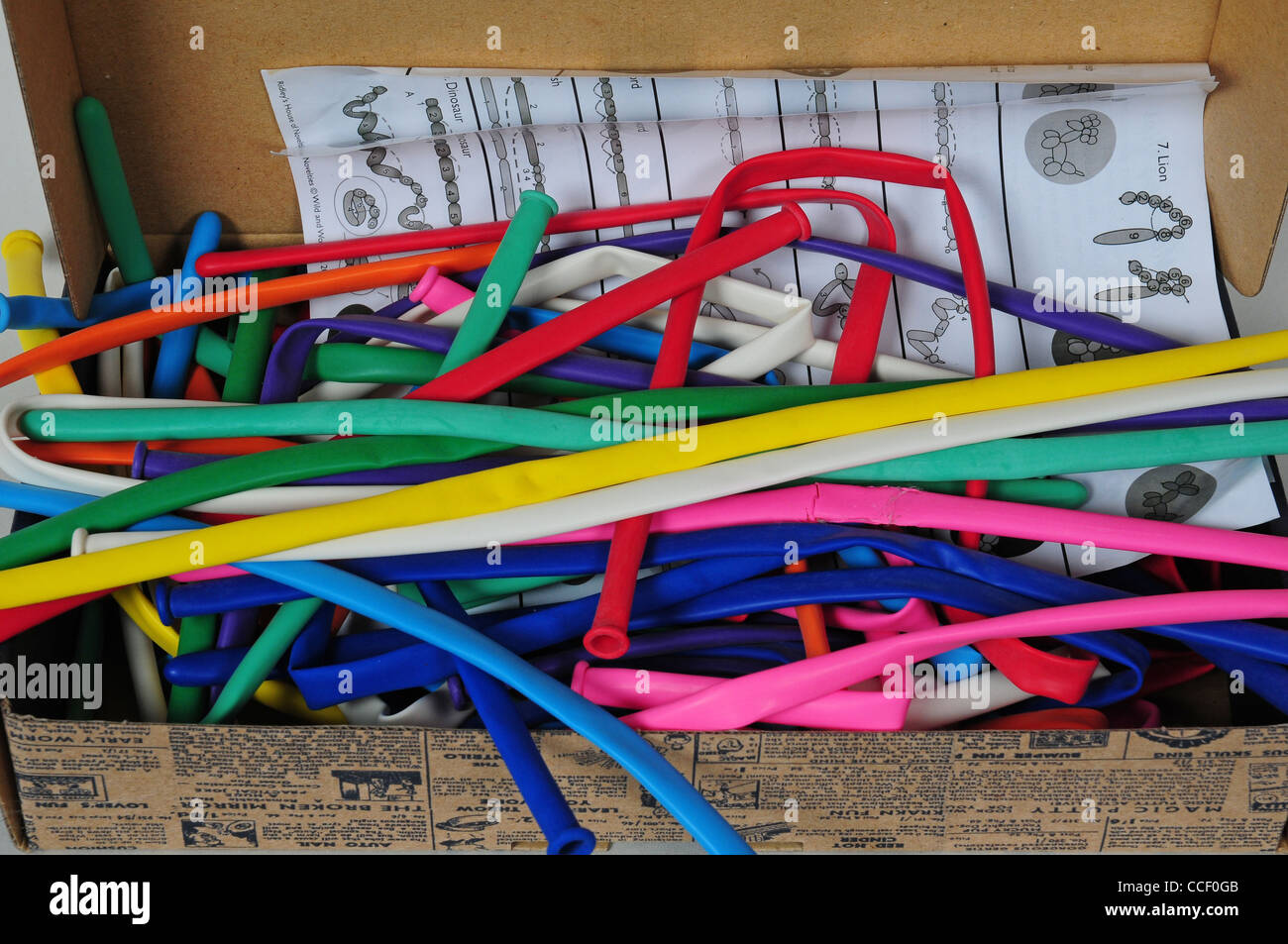Box of modelling balloons with instructions Stock Photo - Alamy