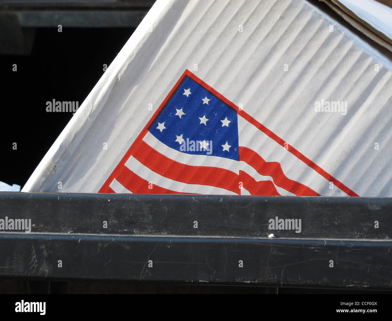 one old cardboard box with american flag in litter rubbish trash can ...