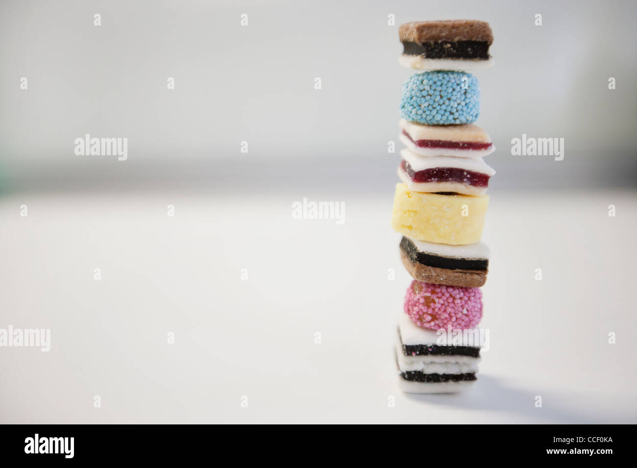 Stack of liquorice sweets on white background Stock Photo - Alamy