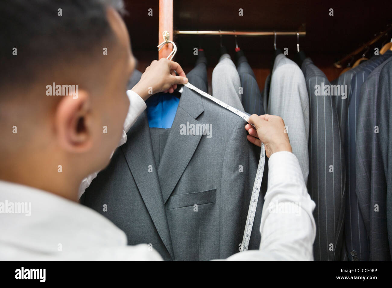 Suits measuring suit hi-res stock photography and images - Alamy