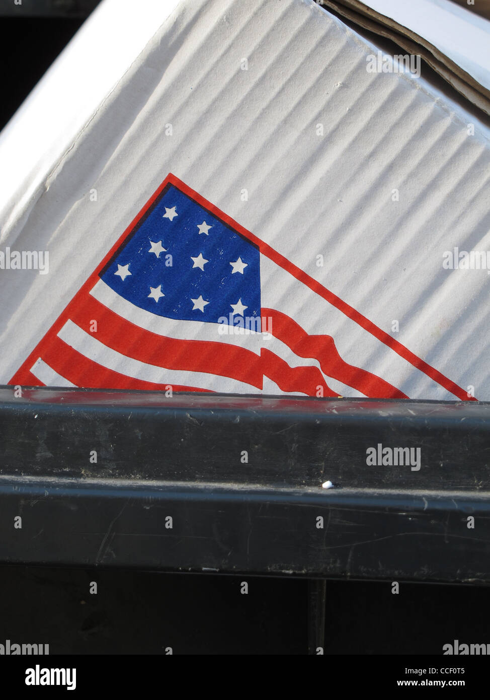 one old cardboard box with american flag in litter rubbish trash can ...