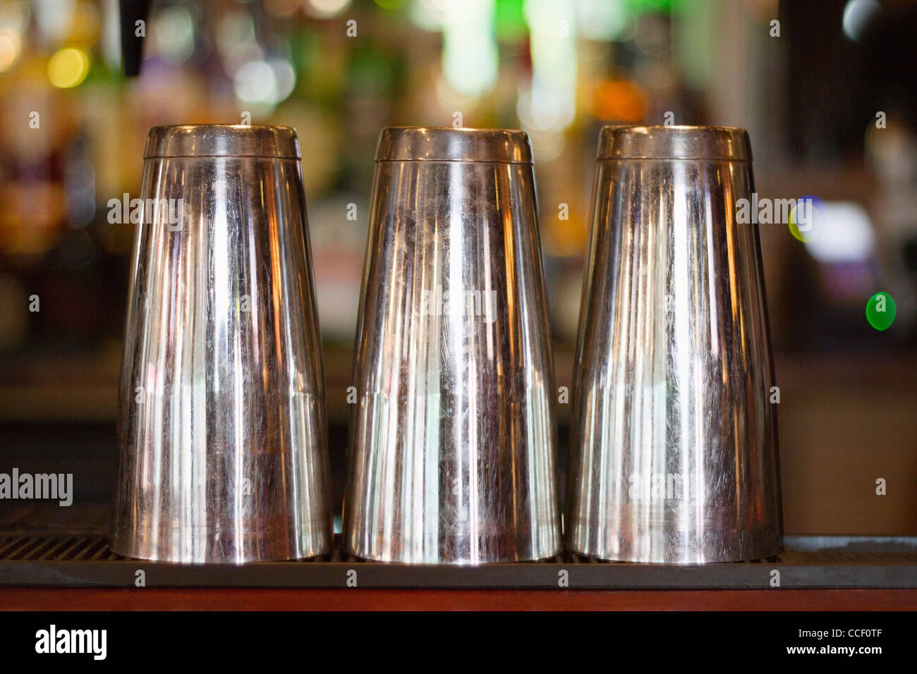 Close-up view of three steel glass kept upside down Stock Photo - Alamy