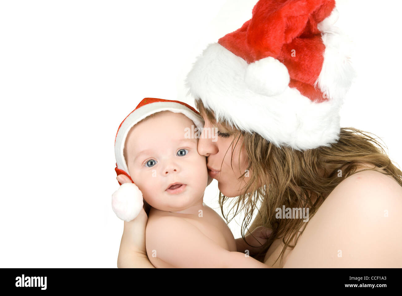Beautiful mommy santa and her baby Santa boy on a white Stock Photo - Alamy