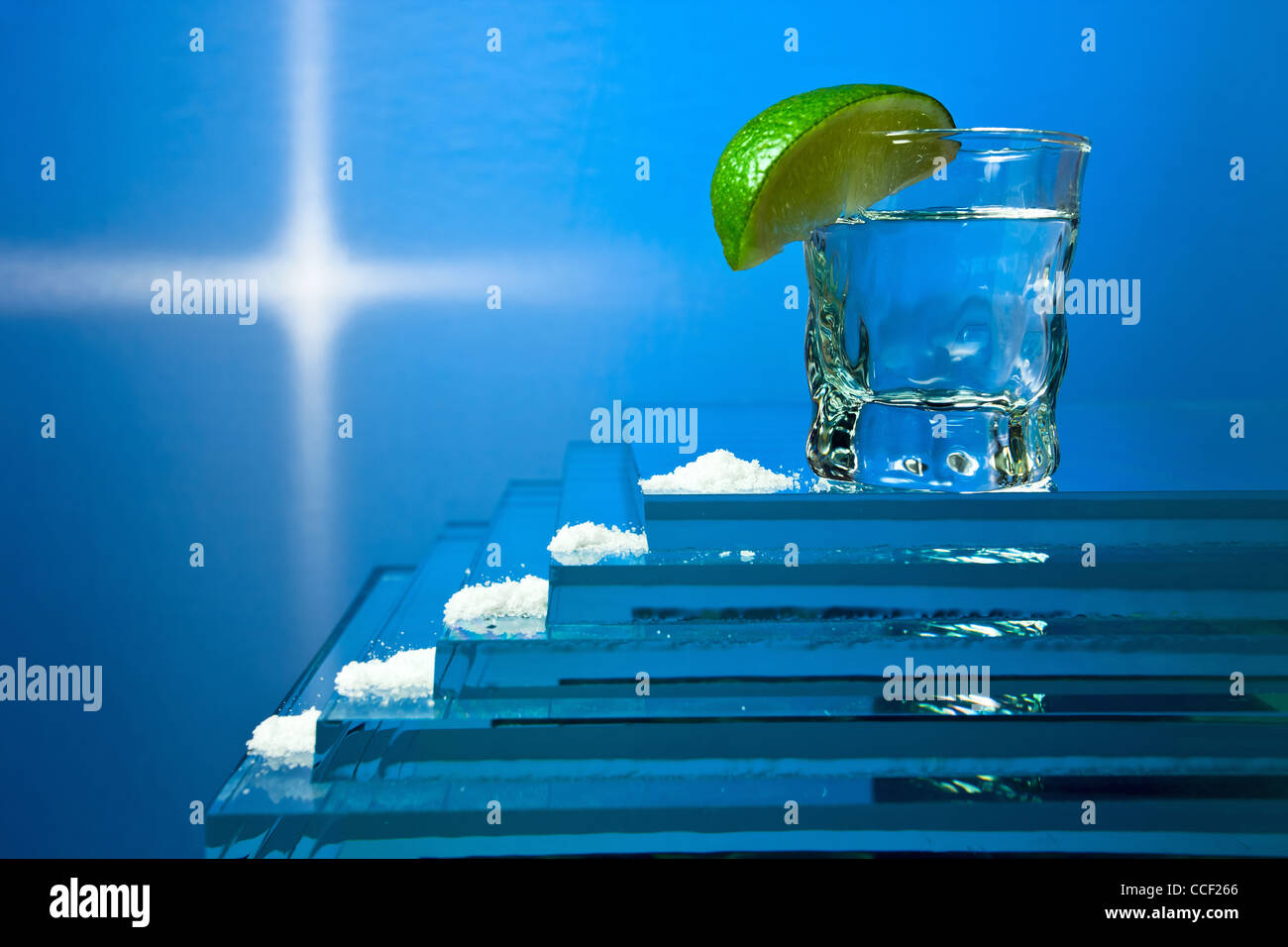 tequila and lime on a glass pyramid Stock Photo - Alamy