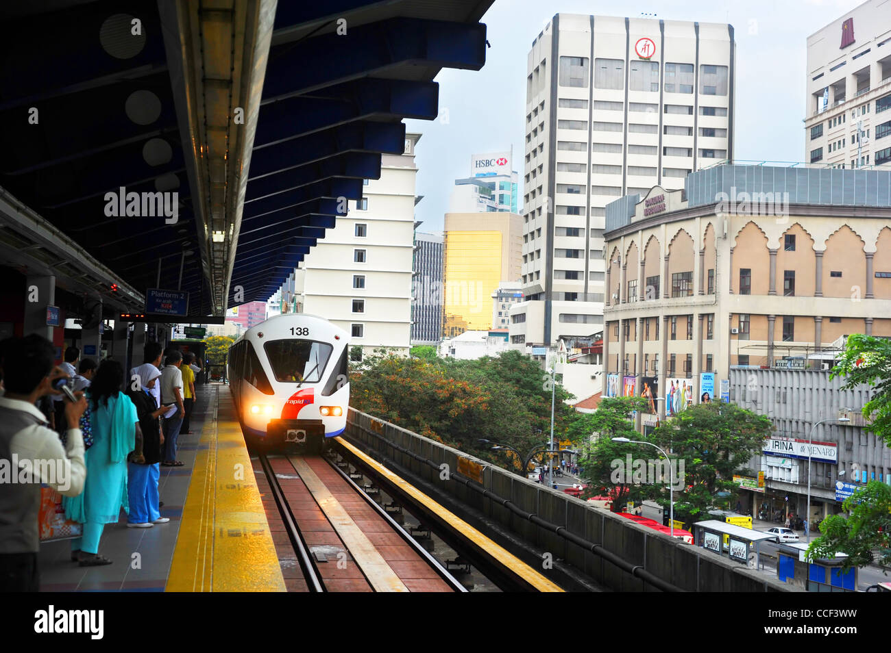 Kuala Lumpur LRT train arriving on train station. Kuala Lumpur's metro ...